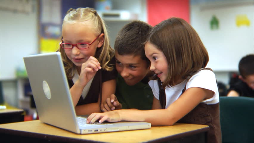 Elementary School Students Looking At Laptop Computer Stock Footage ...