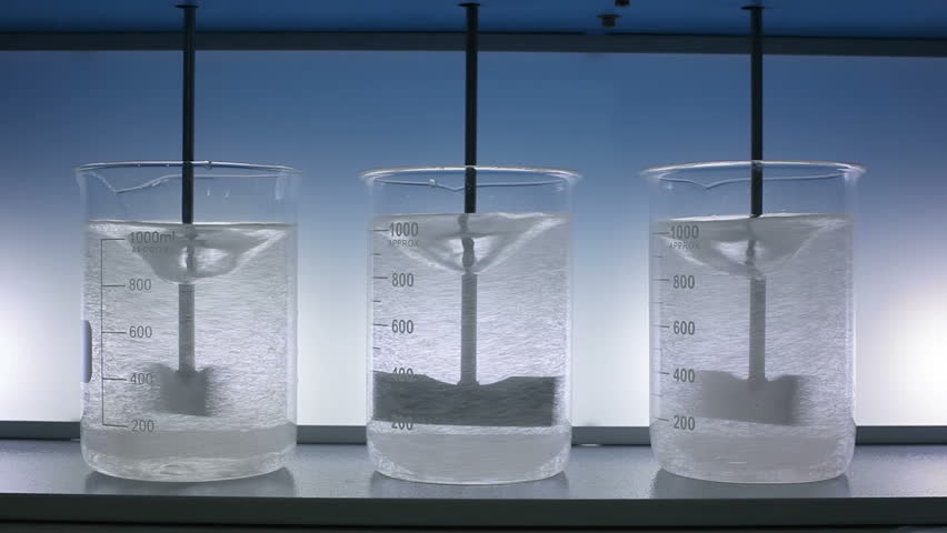 Water Treatment Experiment Flocculation. Stirring Water With Reagent ...