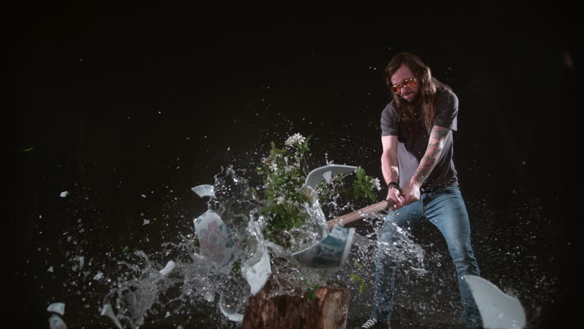 Man Smashing Vase Of Flowers With Hammer In Slow Motion, Shot On ...