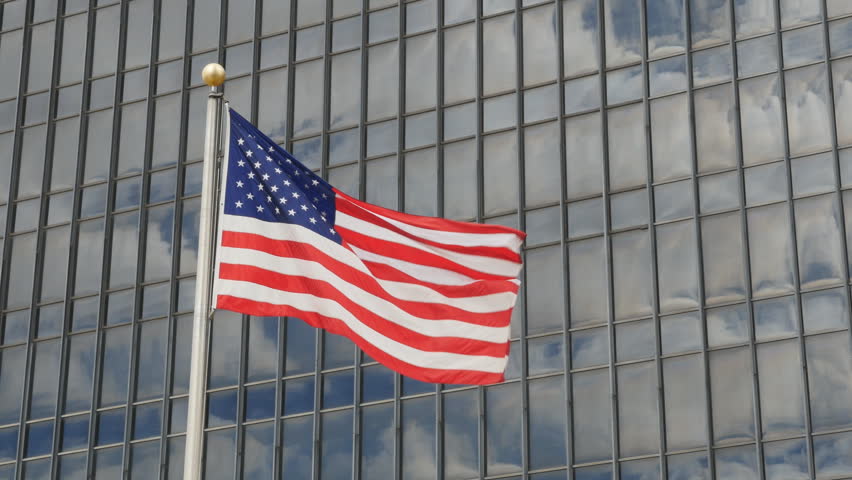 American Flag Flying Front Of Steel And Glass Corporate Office Building ...