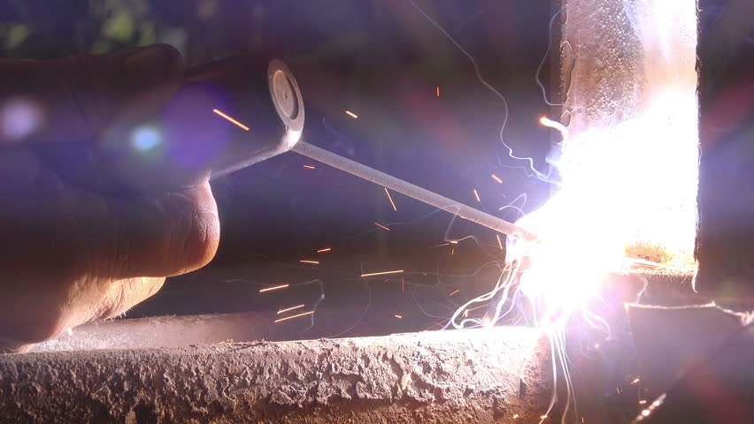 Close Up Macro Footage Of Shielded Metal Arc Welding In Workshop, Male ...