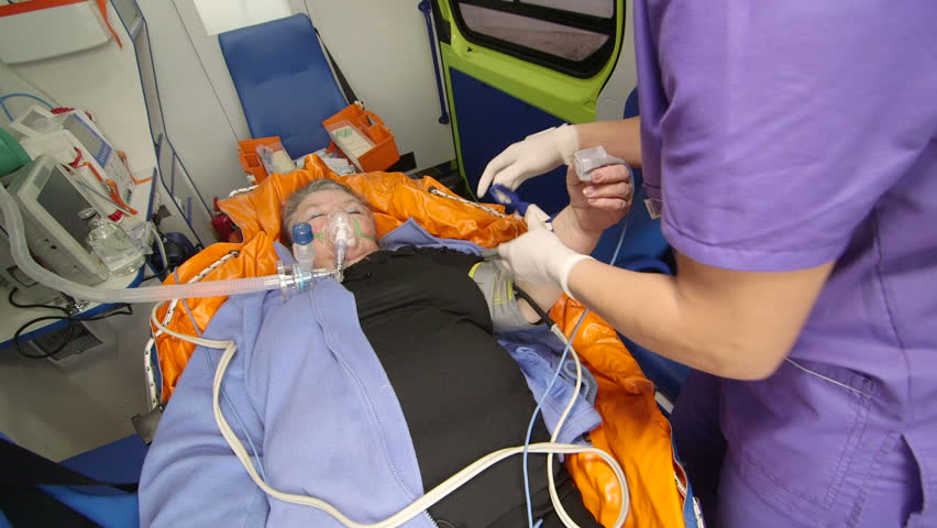 Paramedic Provide Emergency Medical Care To Critical Patient In ...