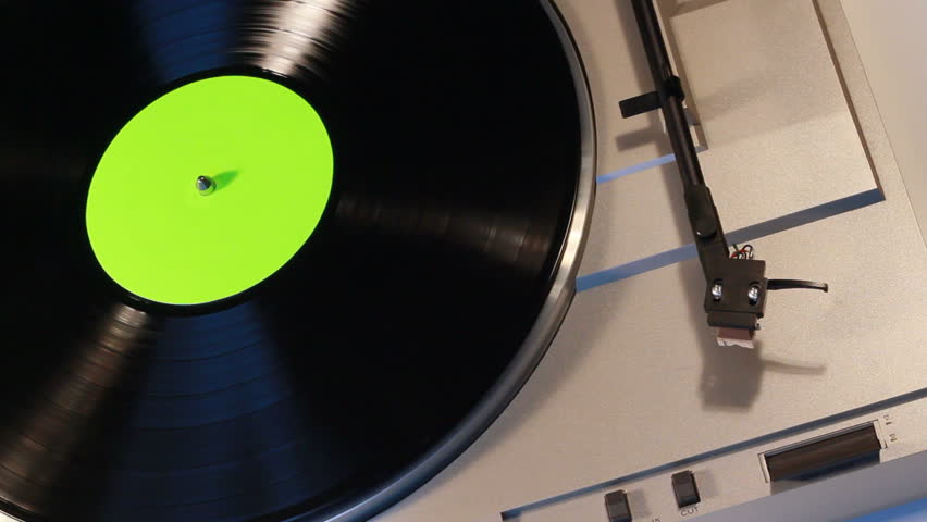 A Closeup View Of A Record Turntable With Green Screen Center For Text ...