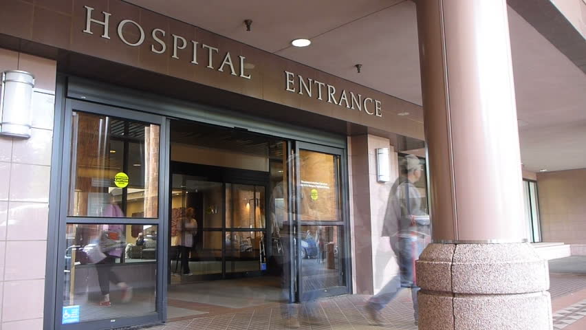 Time Lapse Effect At Hospital Entrance With Patients Entering And ...