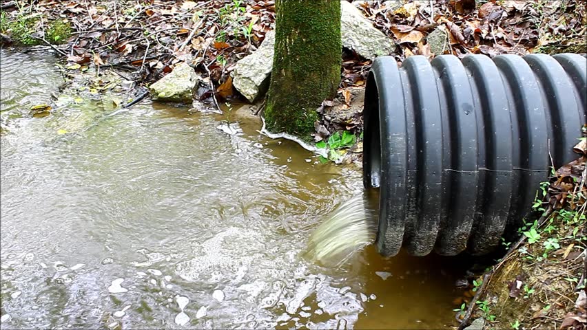 HD Footage Of A Black Plastic Storm Drain Pipe With Storm Water Runoff ...