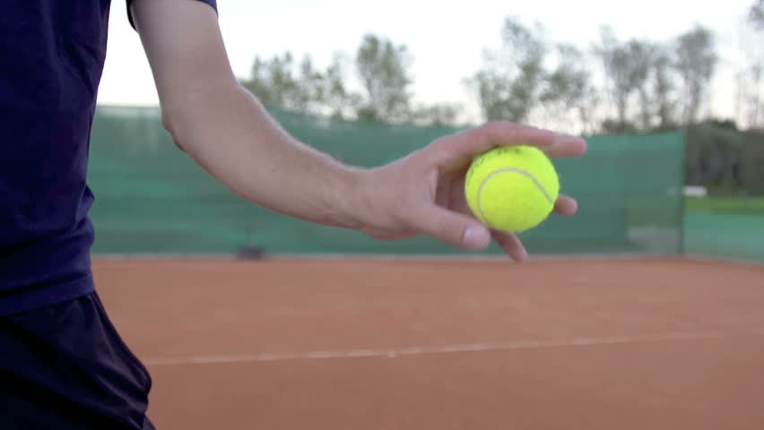 Slow Motion Shot Of A Professional Tennis Player Throwing And Catching ...