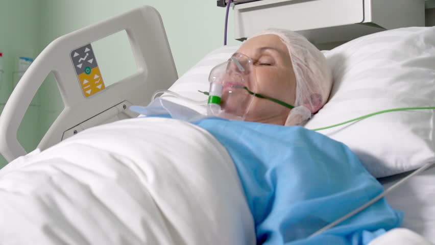 Tilt Down Of A Senior Patient Waking Up After General Anesthesia Stock ...