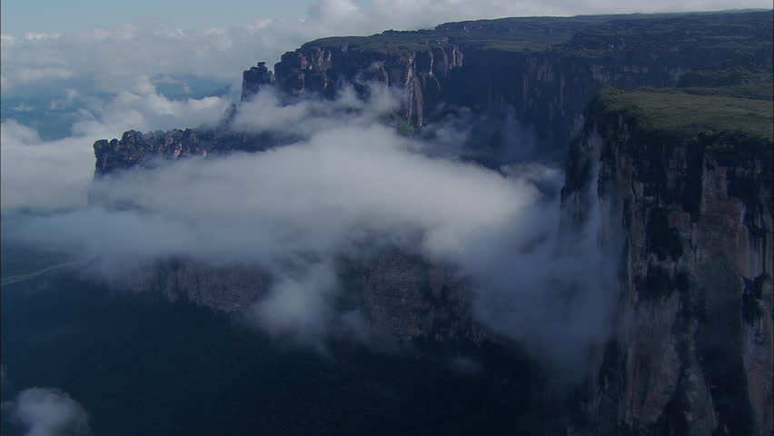 Mountains Ridge Cliffs Clouds. A High Elevated View Of A Steep Mountain ...