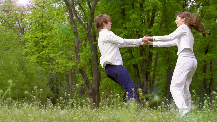 Young Man And Woman Are Running Towards Each Other Trying To Meet In ...
