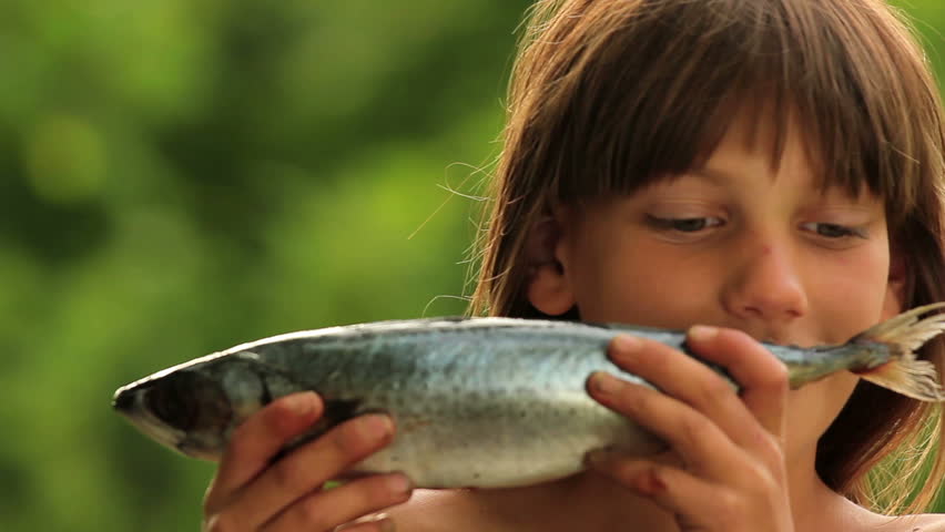 Boy Holding A Marine Fish.Child Preparing Fish.Little Cook.Teenager ...