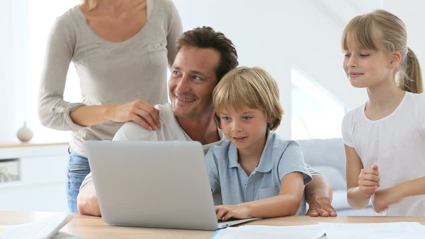 Parents With Children Using Laptop Computer At Home Stock Footage Video ...